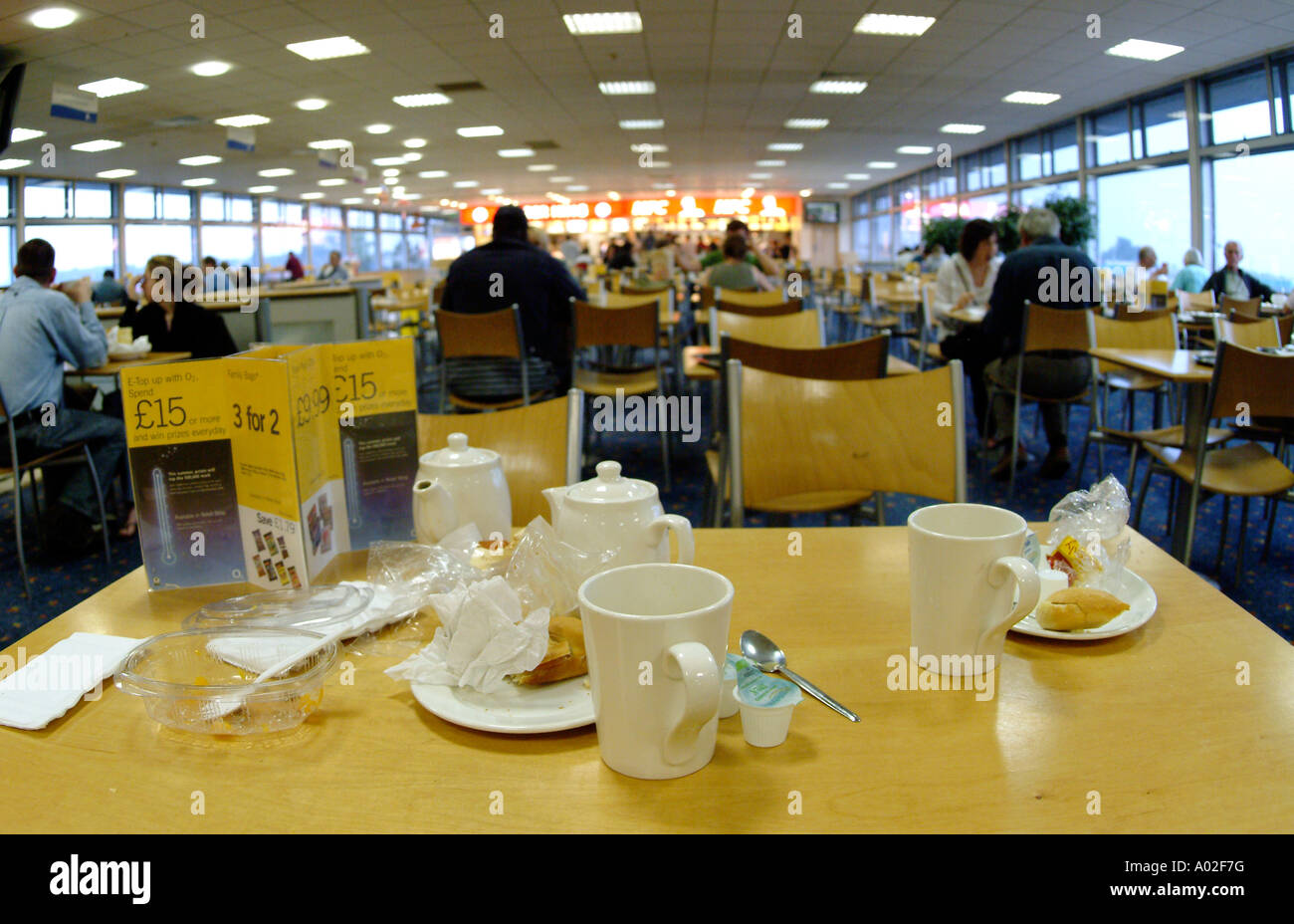 Dirty crockery left on an uncleared table in a service station the ...
