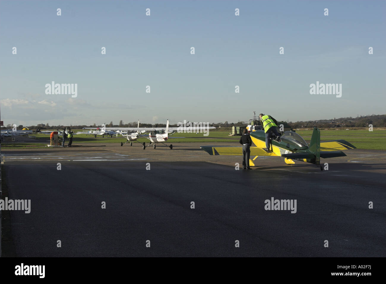 Small aircraft queue for refuelling Stock Photo - Alamy