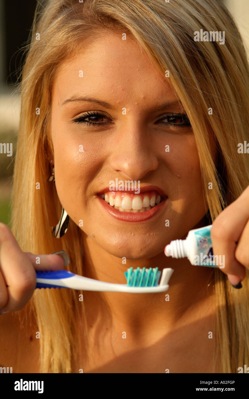 portrait of a teenager with toothpaste and brush Cleaning teeth Dental ...