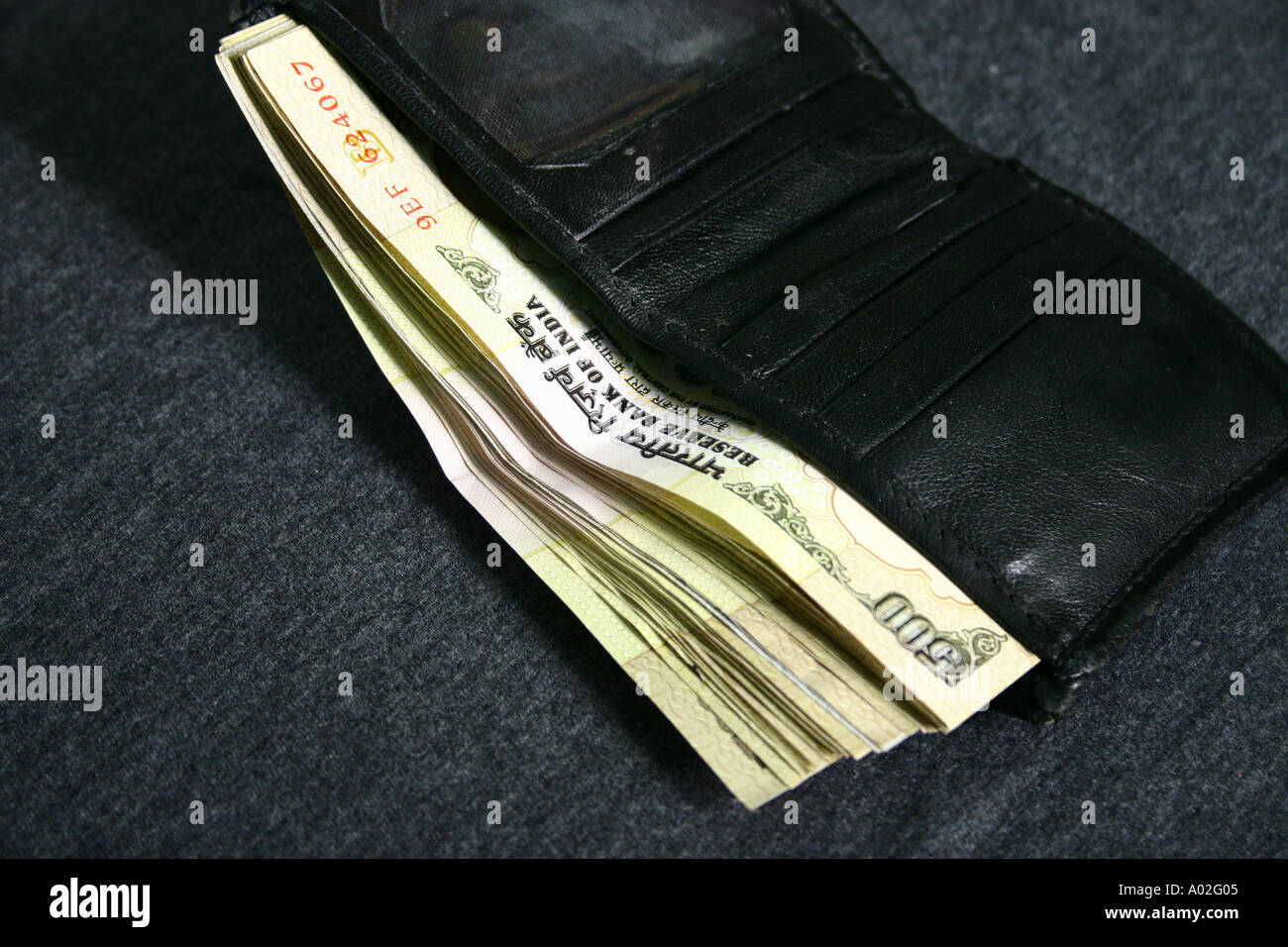 Indian paper notes currency Purse overflowing with money Stock Photo ...