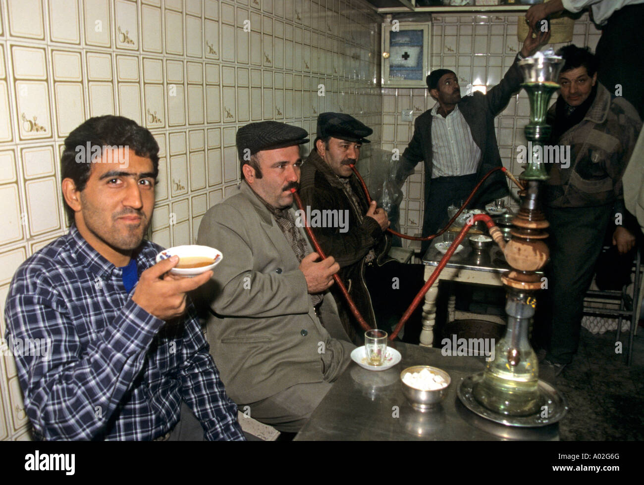 Drinking tea and smoking hookah at a tea house in Tehran Iran Stock ...