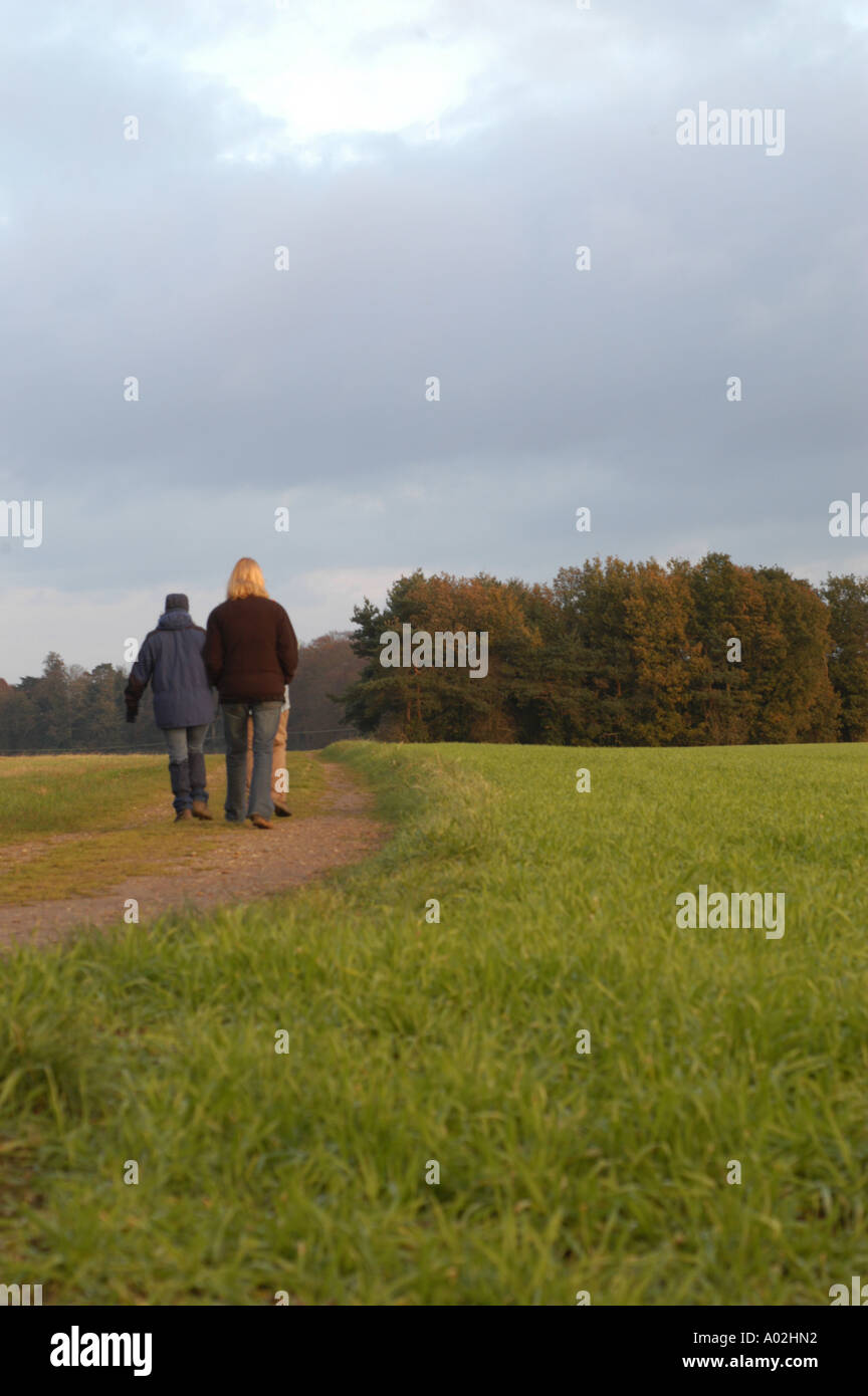 two people walking Stock Photo - Alamy