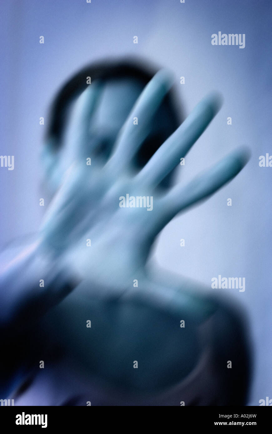 Woman hiding her face with hand Stock Photo - Alamy