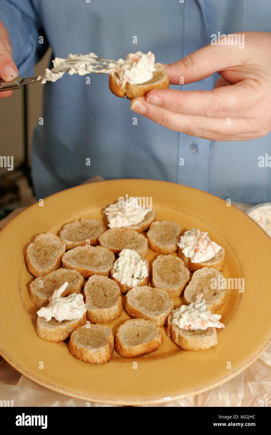 Miami Florida,making hors d'oeuvres,sliced Italian bread,cream cheese ...