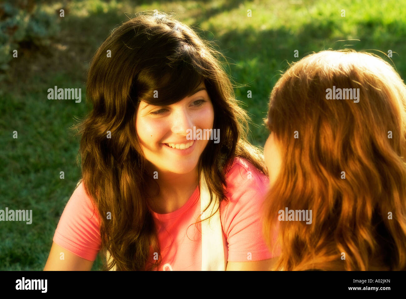 Two girls talking each other Stock Photo - Alamy