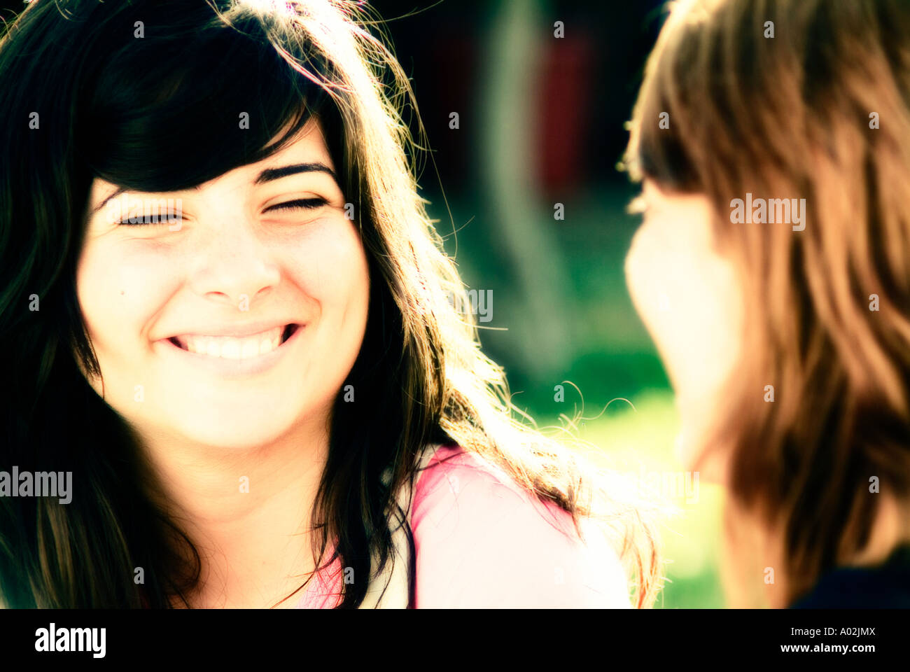 Two girls talking each other Stock Photo - Alamy