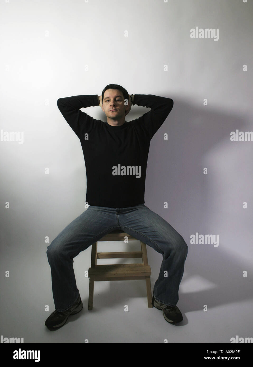 Man sat down hands on head hi-res stock photography and images - Alamy