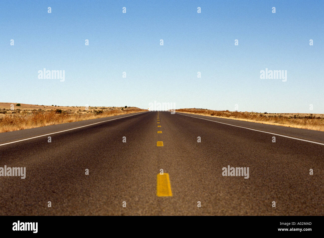 Long lonely Straight Asphalt Secondary Highway With Broken Yellow ...