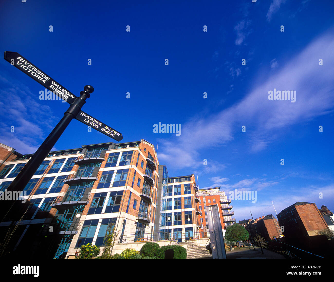Riverside walk between Victoria Bridge and Leeds Bridge with modern ...