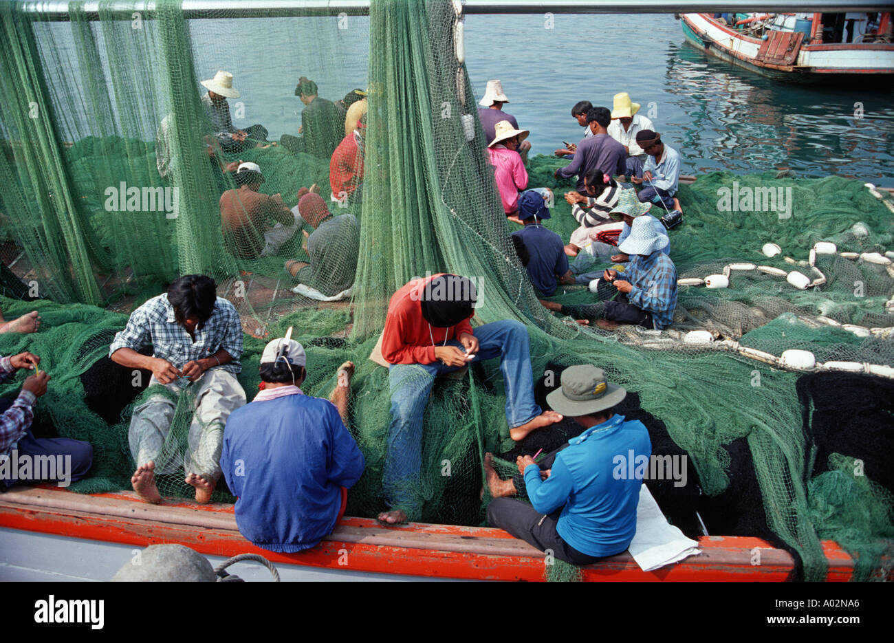 Washing fishing nets hi-res stock photography and images - Alamy