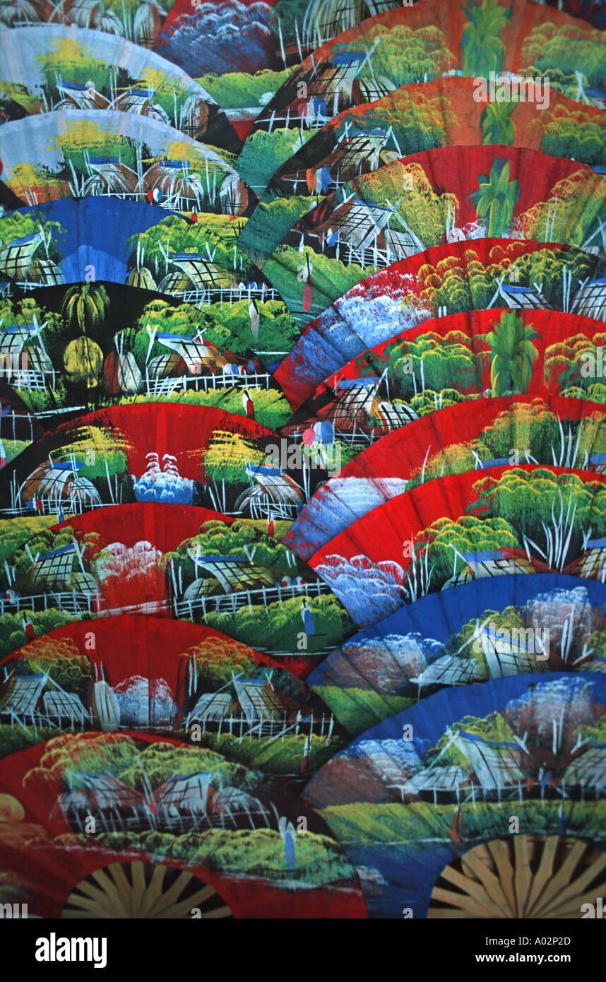 Selection of hand painted paper fans for sale from a street market ...