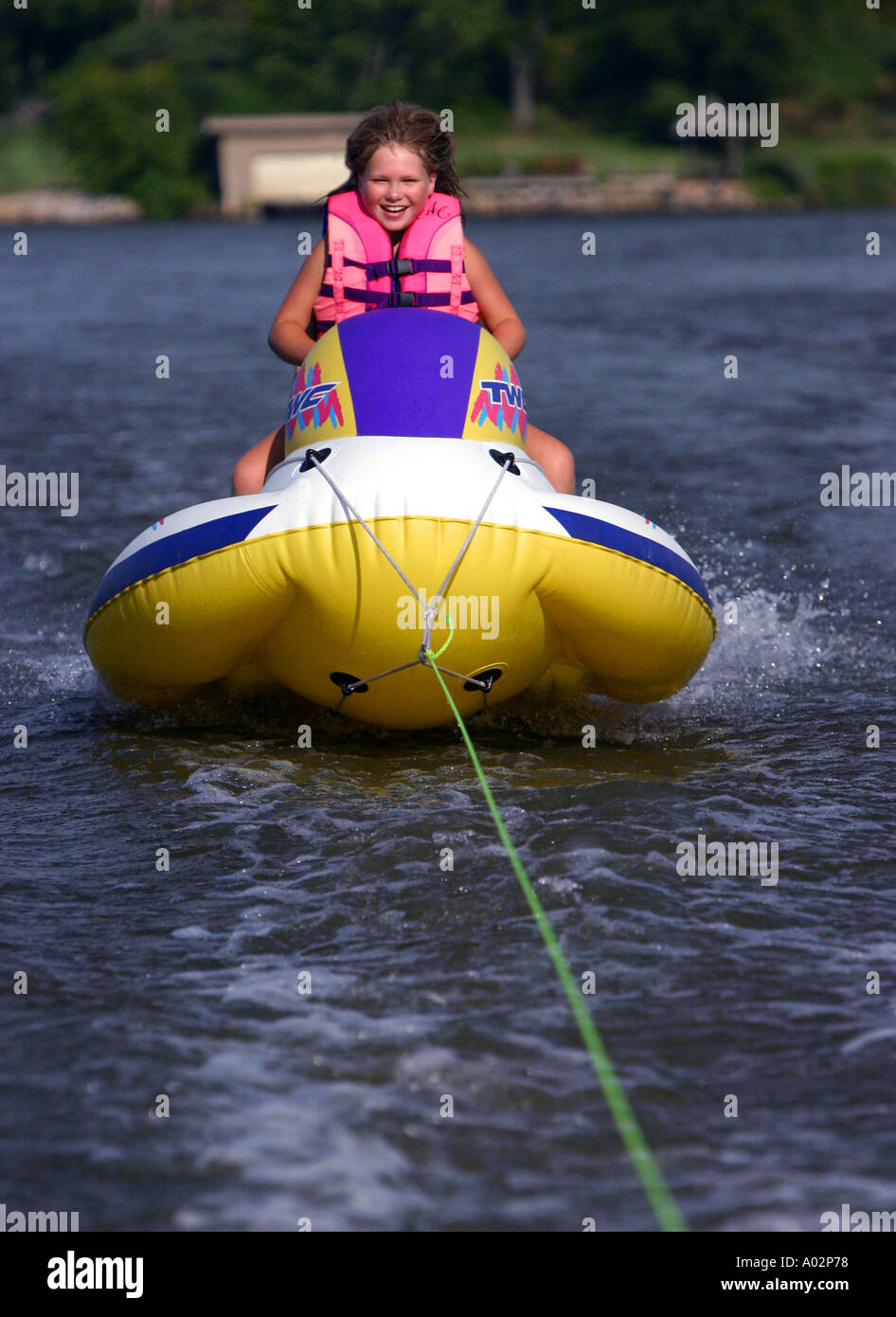 Girl on raft Stock Photo - Alamy