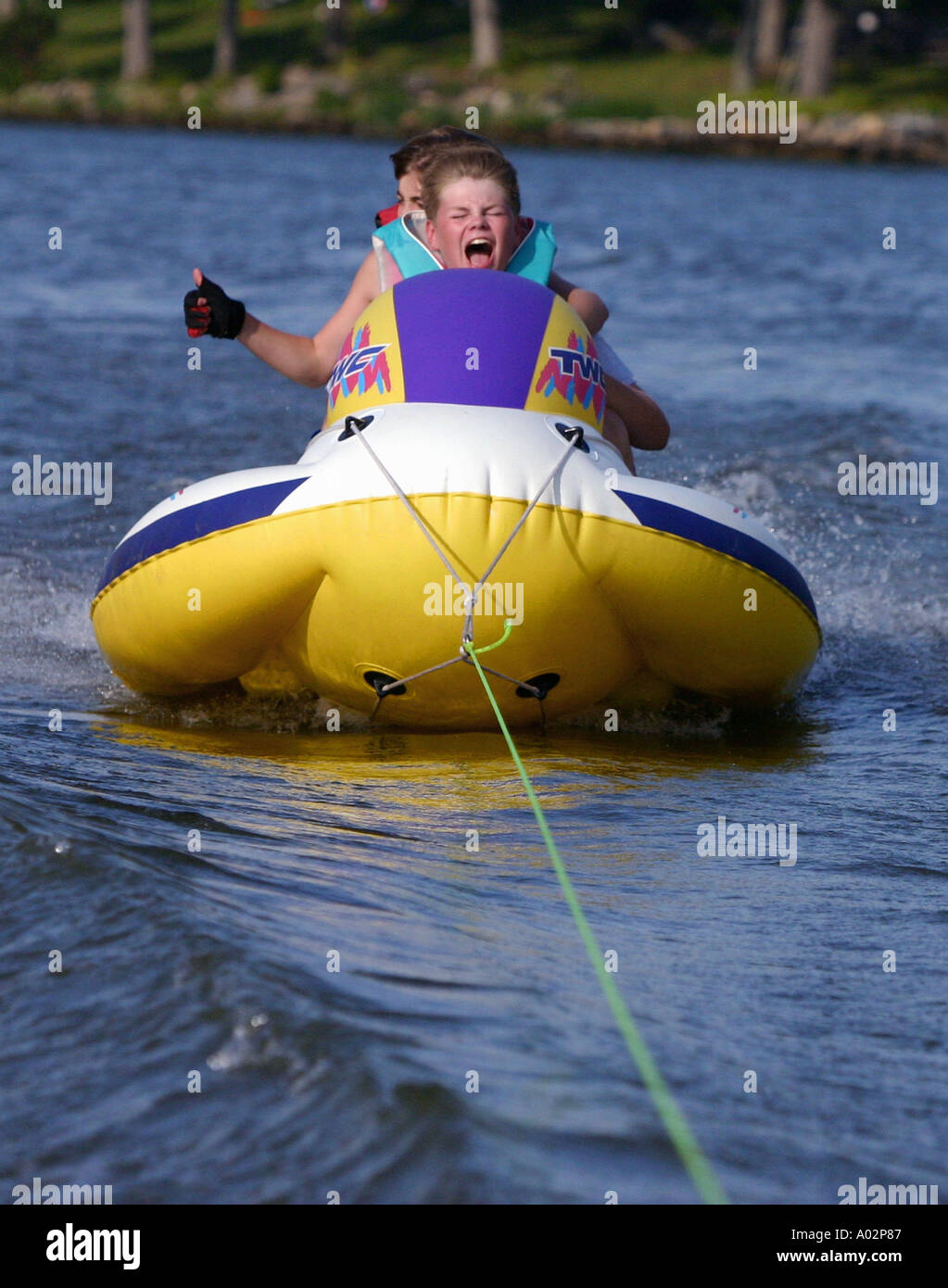 Boys on raft Stock Photo - Alamy