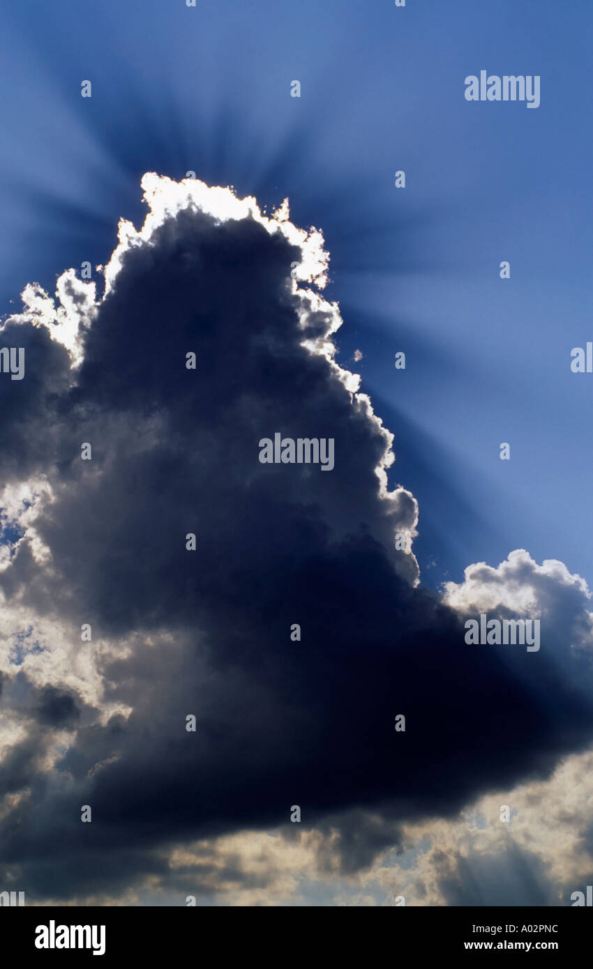Sun rays behind cloud Stock Photo - Alamy