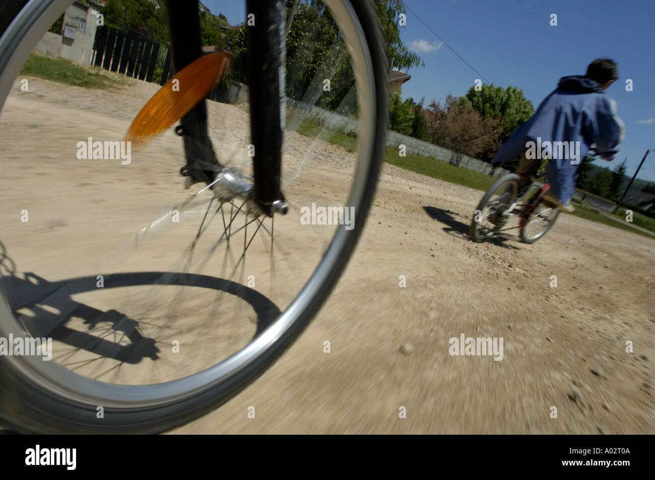 Front wheel of a mountain bike on a dirt road Stock Photo - Alamy