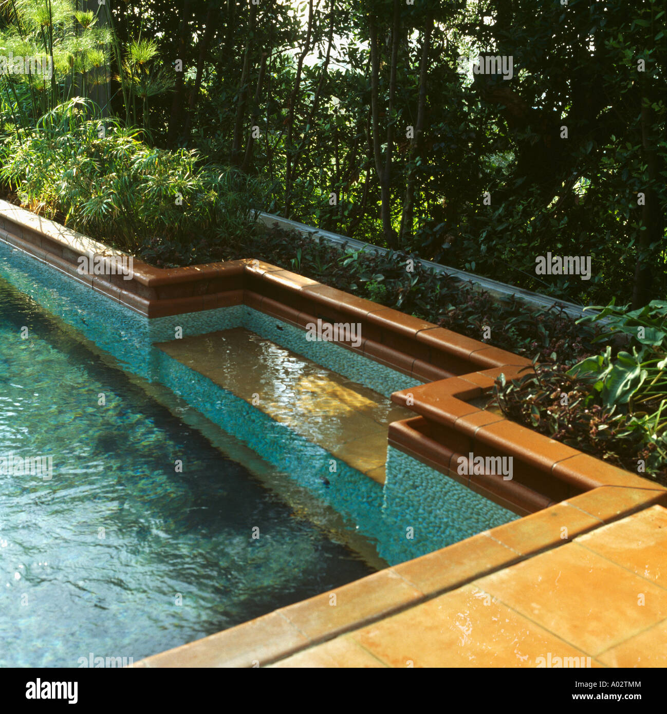 Integral seat in swimming pool with tiled surround Stock Photo - Alamy