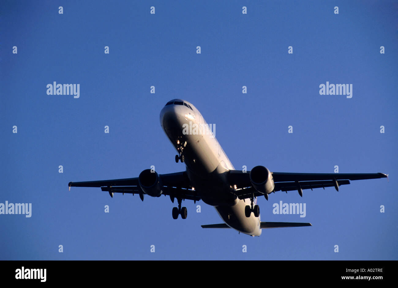 Airplane in the sky over Paris, France Stock Photo - Alamy