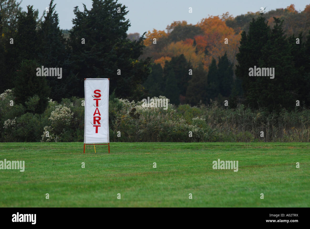 A Start sign in a large field at a sporting event race Stock Photo - Alamy