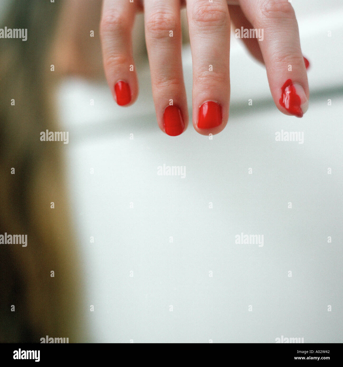 painted fingertips draped over bath tub fingernail dripping red nail polish Stock Photo - Alamy