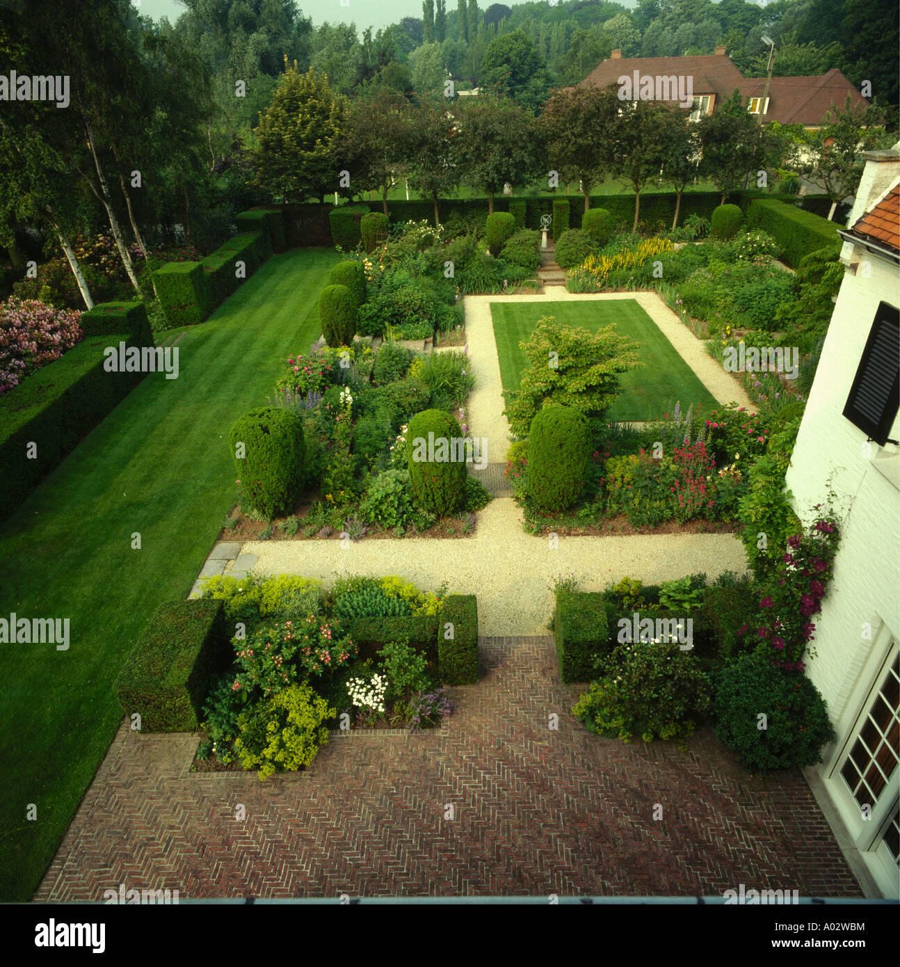 Aerial view of patio and small rectangular lawn with gravel paths edged ...