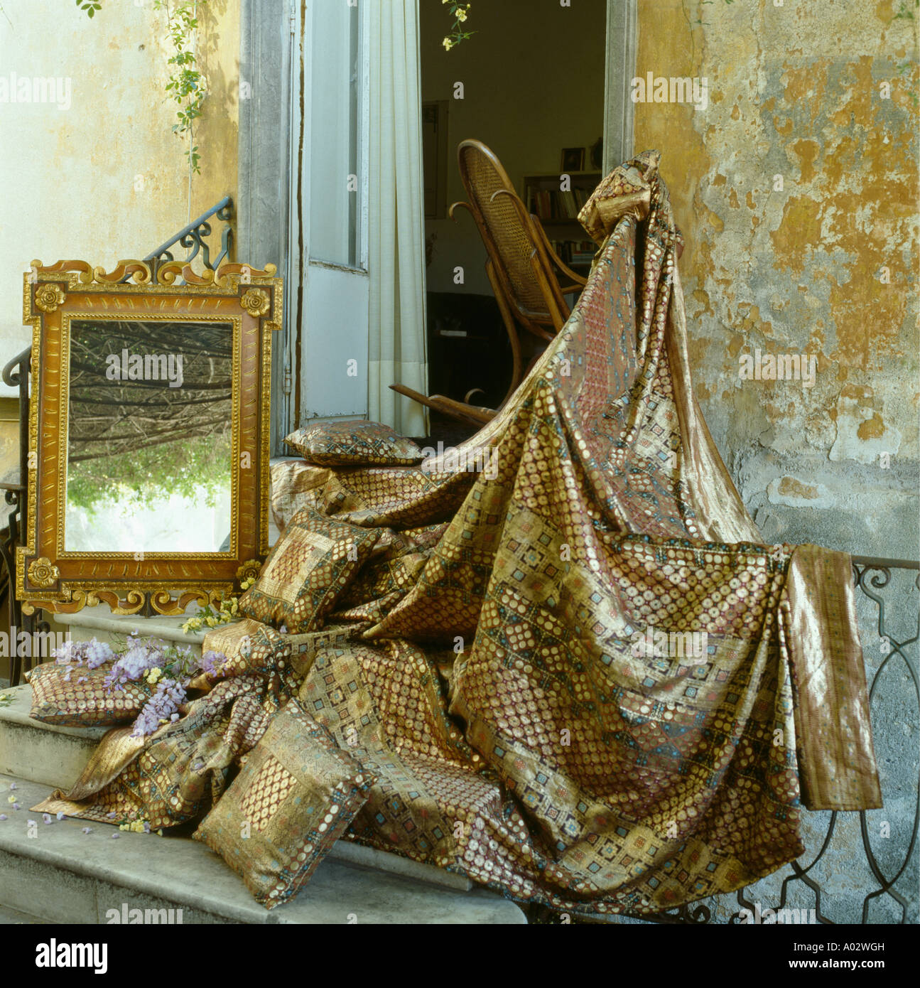 Still-Life of gilt mirror and draped metallic gold fabric Stock Photo ...