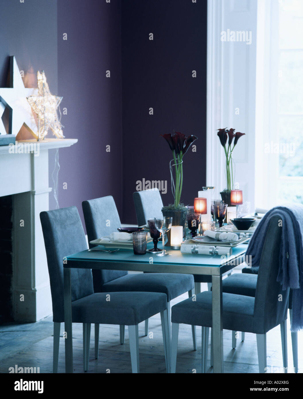 Modern grey diningroom with Christmas table settings Stock Photo - Alamy