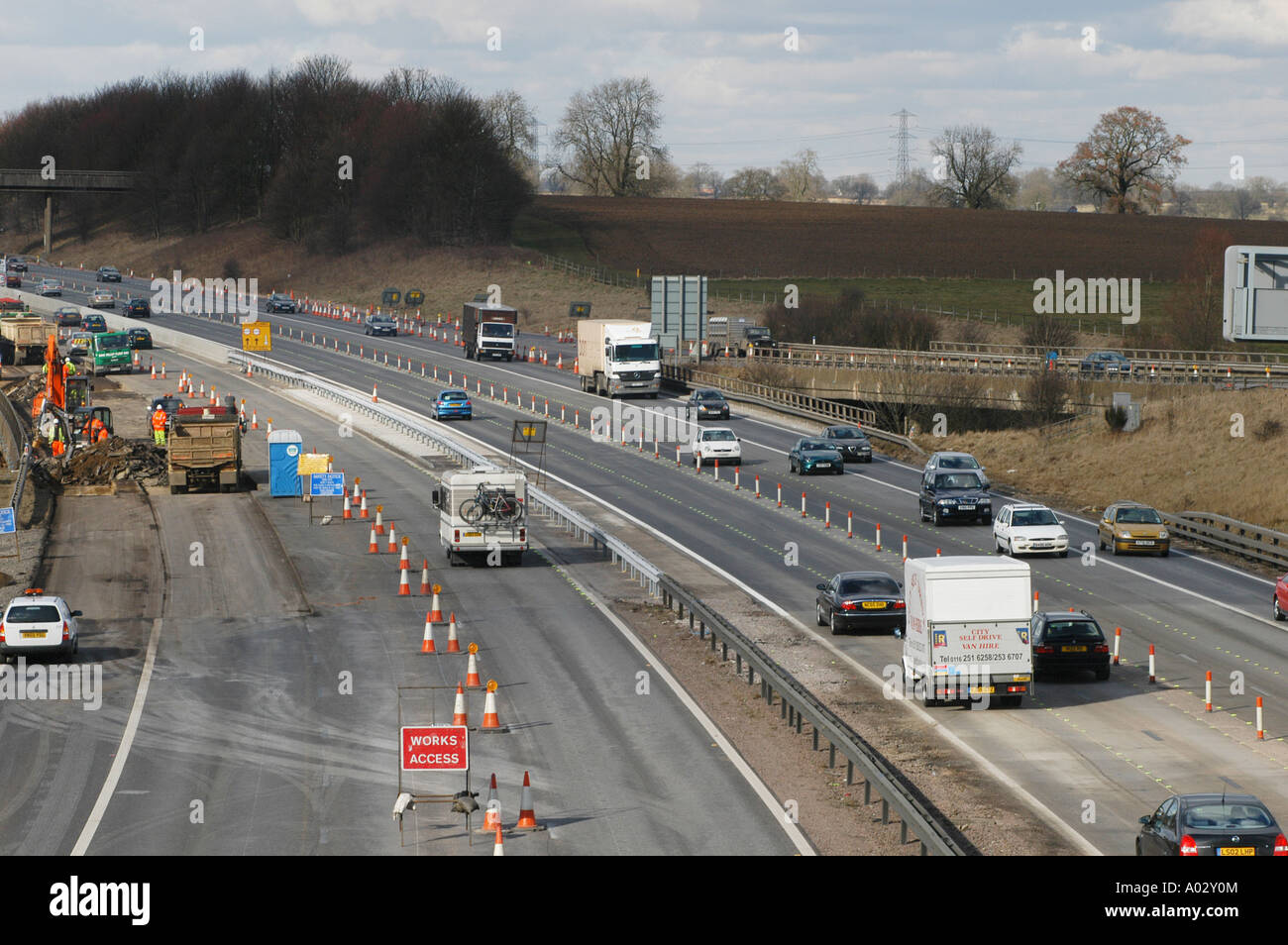 traffic driving through a contraflow due to roadworks on a uk motorway ...