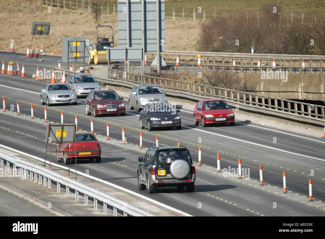 traffic driving through a contraflow due to roadworks on a uk motorway ...