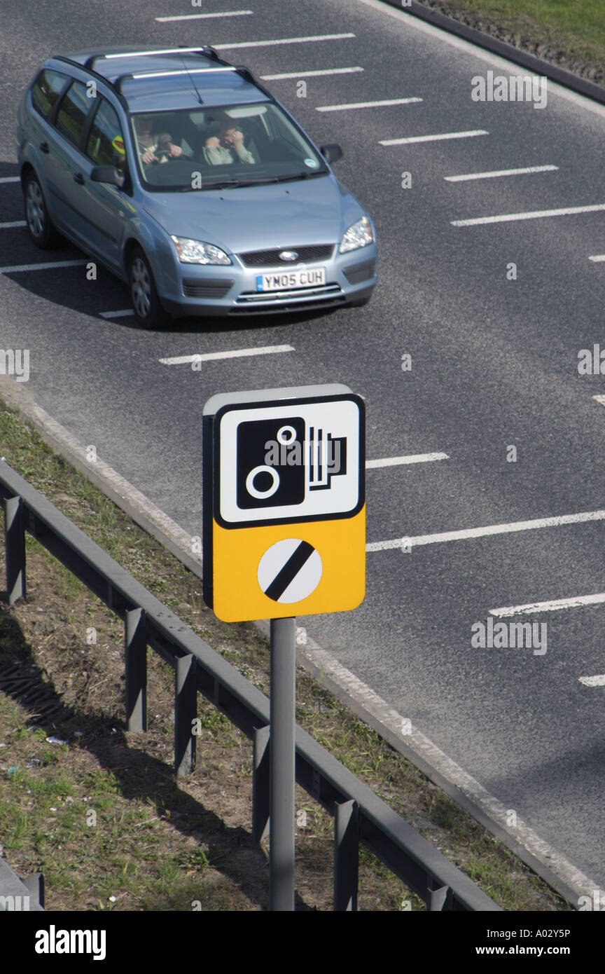 car passing a speed safety camera sign Stock Photo - Alamy
