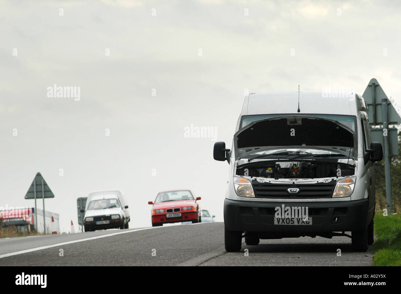 Broken down white van at the side of a dual carriageway in England ...