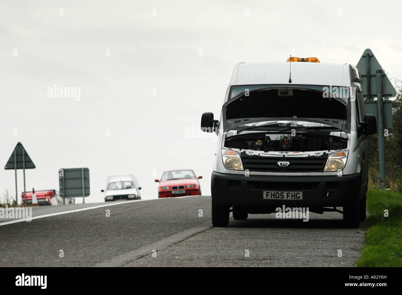 Broken down white van at the side of a dual carriageway in England ...