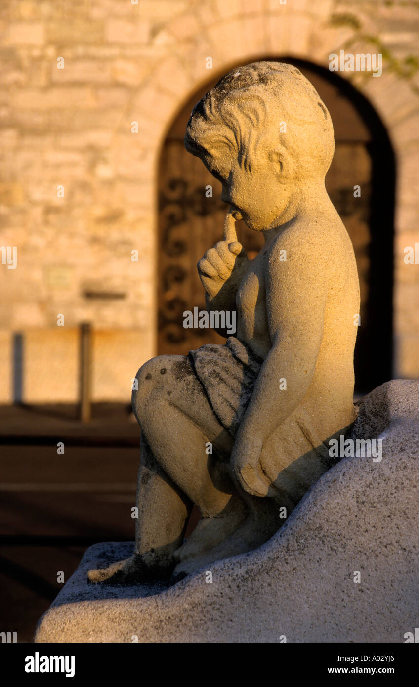 Cherub Statue Inviting To Silence Stock Photo - Alamy