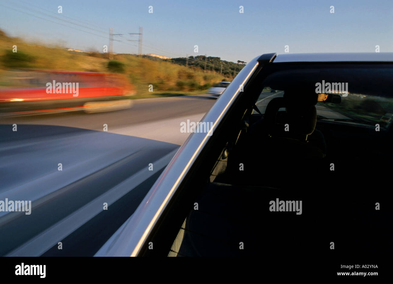 White car speeding hi-res stock photography and images - Alamy