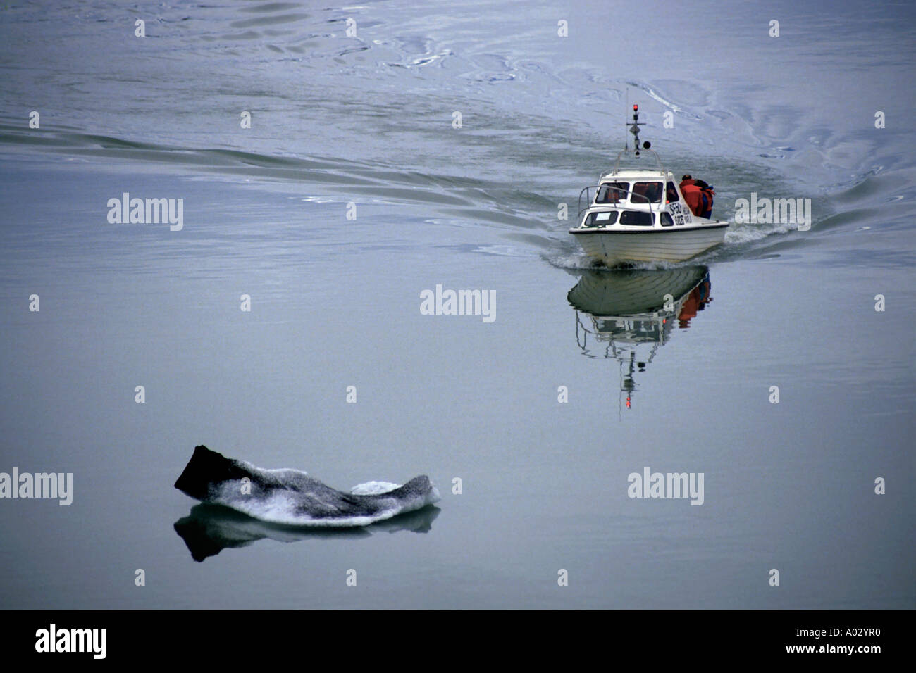 Iceberg Facing A Boat Stock Photo - Alamy