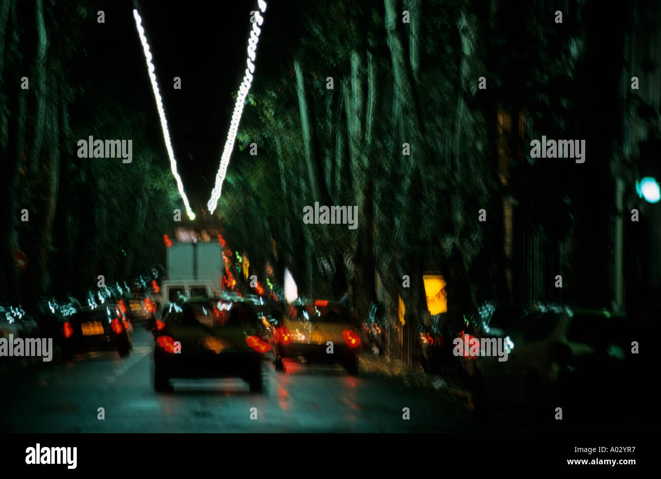 Blurred cars on a boulevard by night Stock Photo - Alamy