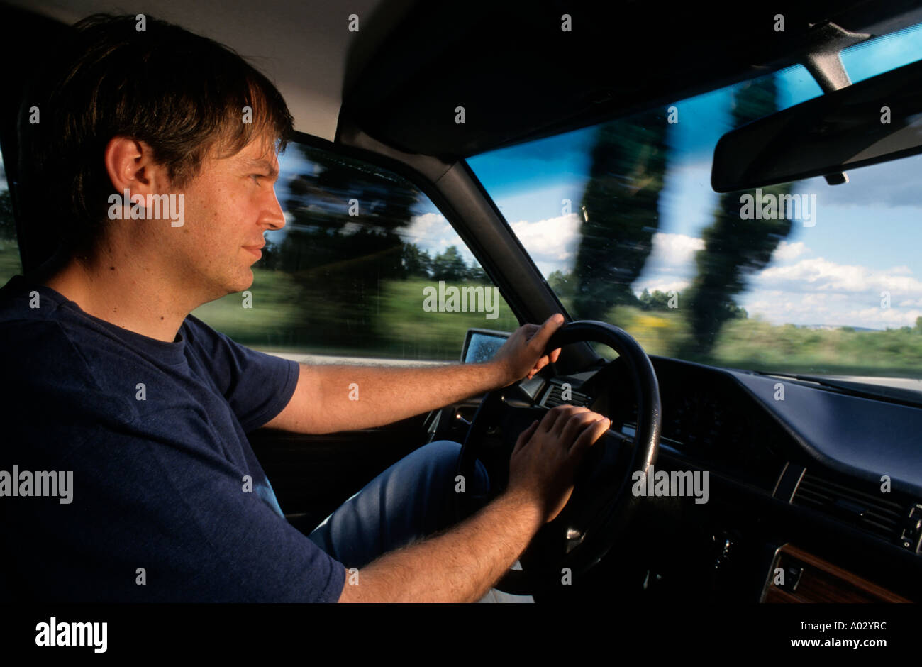 Man driving car Stock Photo - Alamy