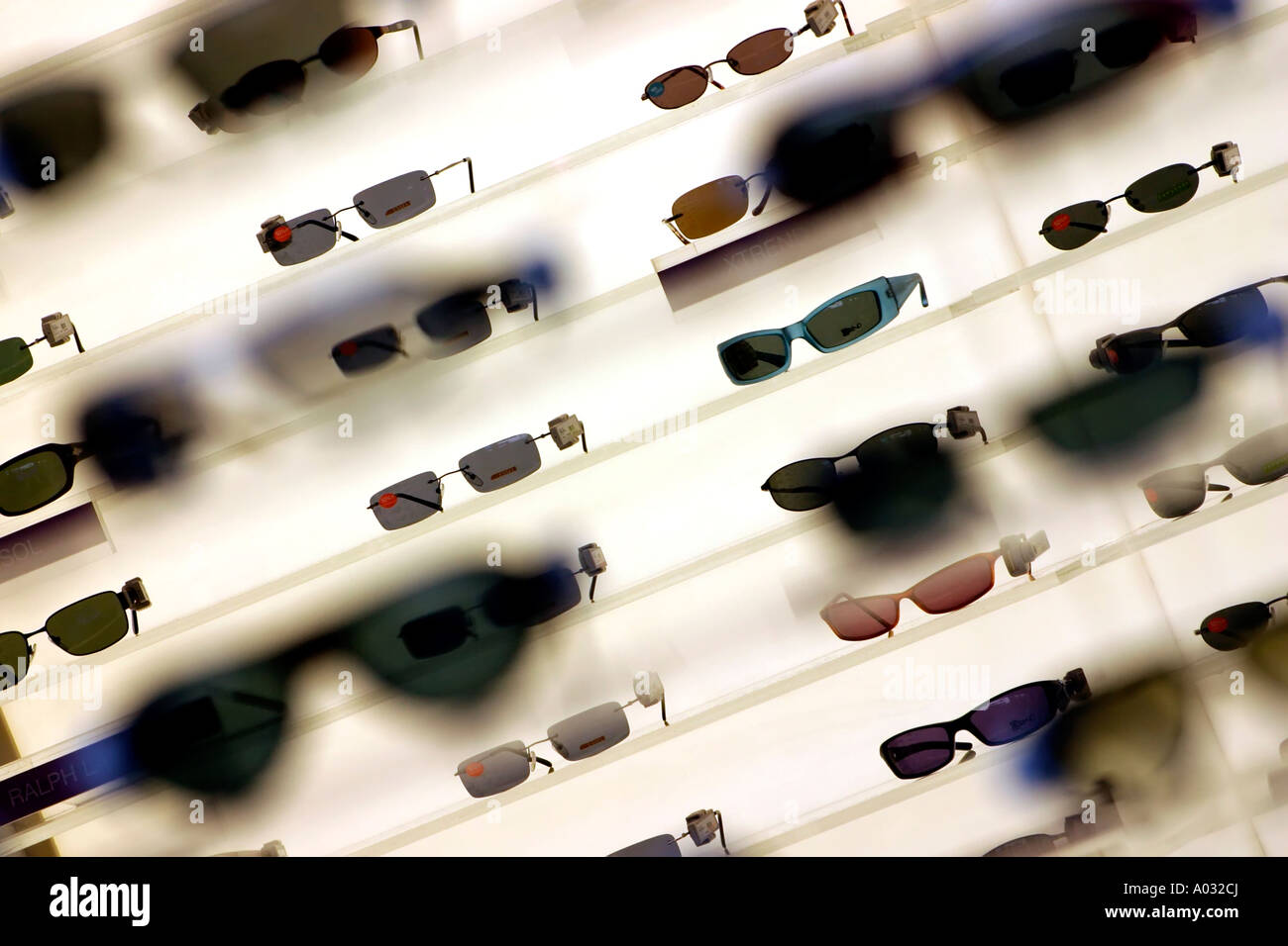 sunglasses in a shop window display Stock Photo - Alamy