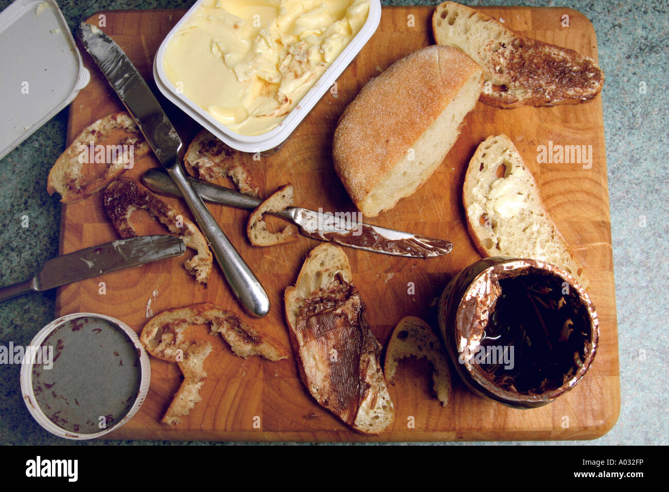 messy breadboard after being used by young children to make breakfast ...