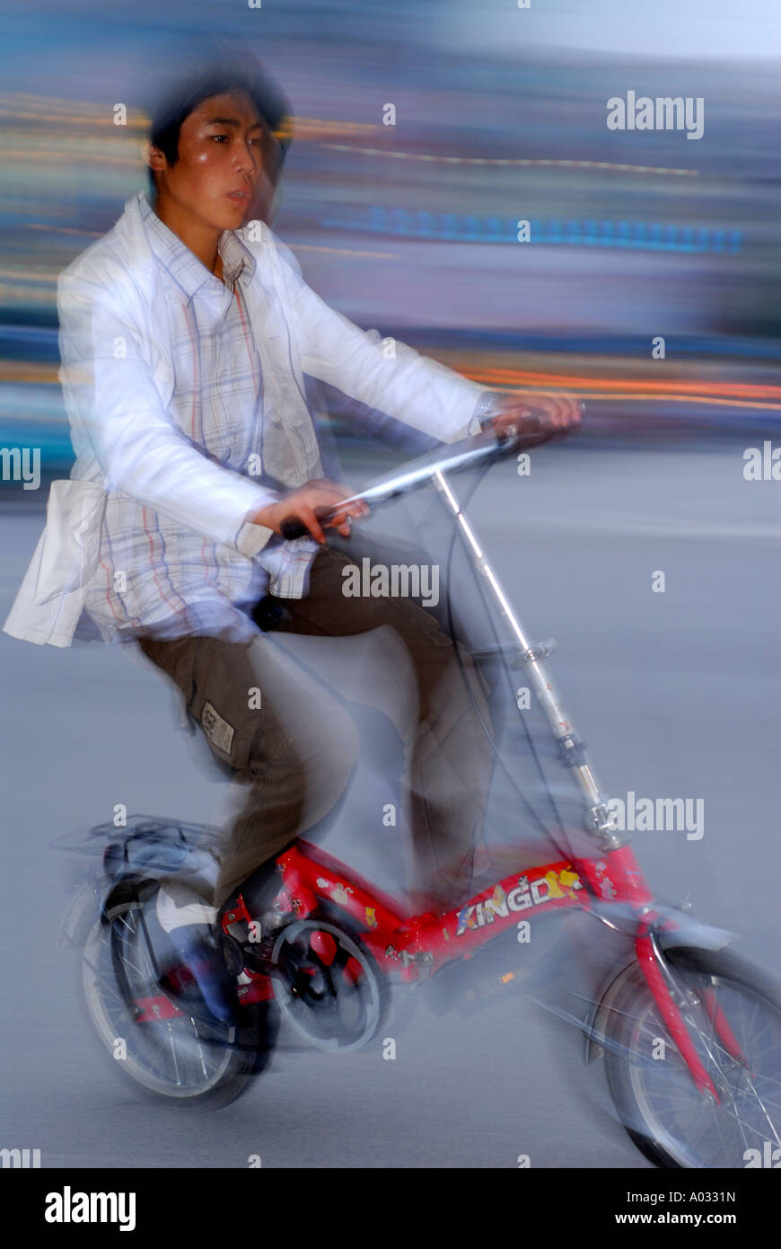 Chinese man riding bicycle China Stock Photo - Alamy