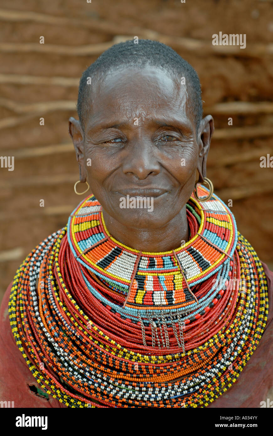 Old and half blind Samburu woman wearing colorful tribal decorations ...