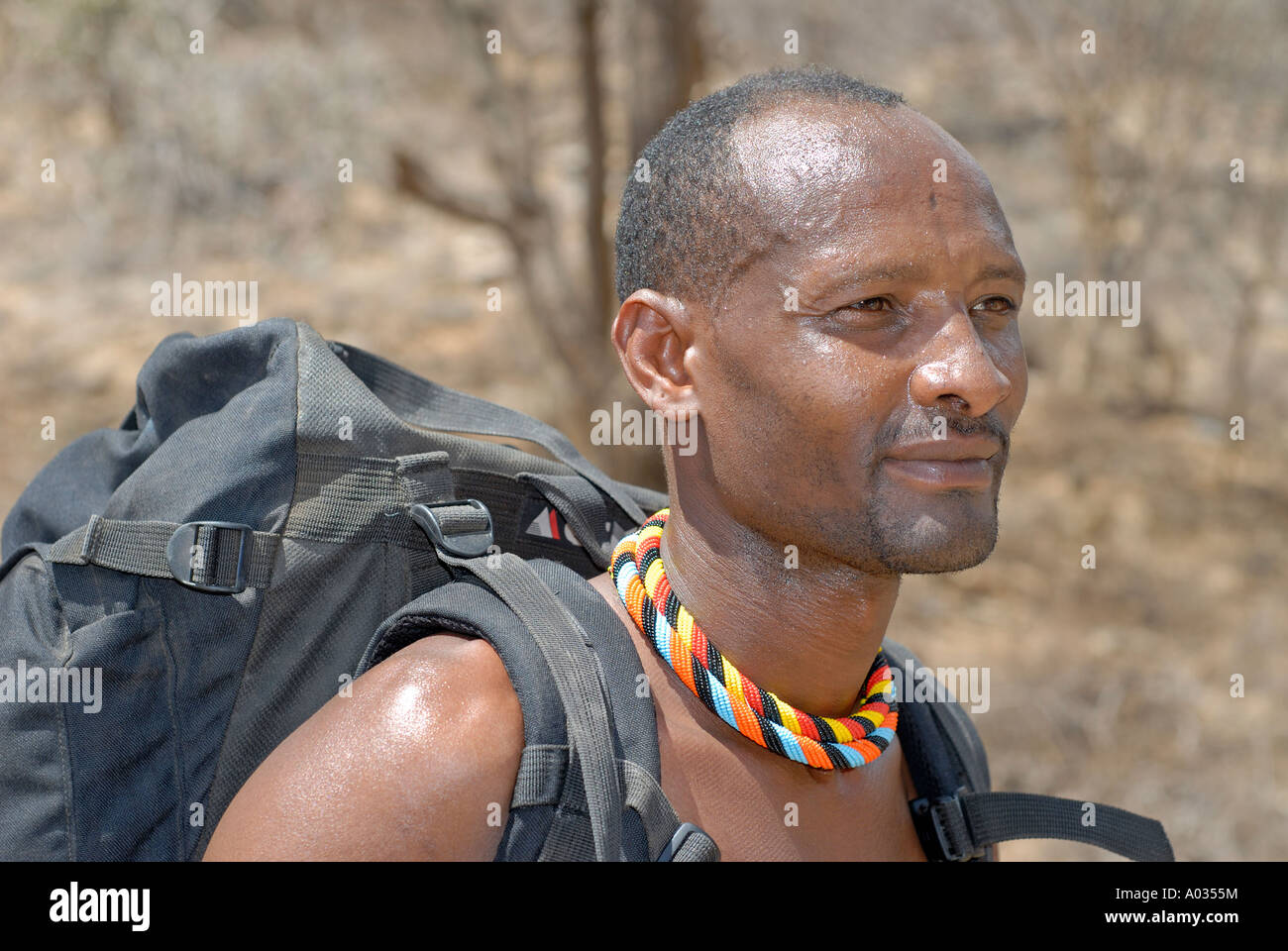 Samburu warrior wearing backpack Kenya Stock Photo - Alamy