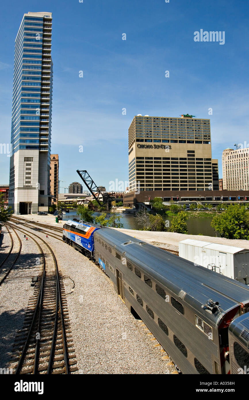 ILLINOIS Chicago Metra commuter train on tracks along Chicago River ...