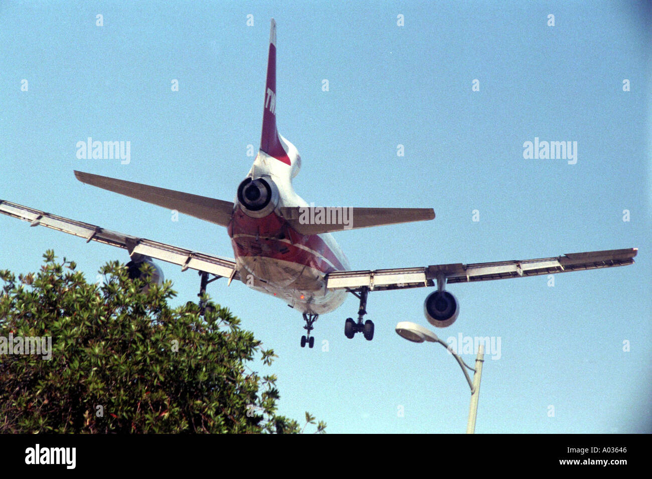 Jet decending to run way Stock Photo - Alamy