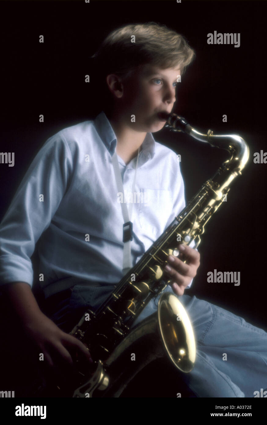 Boy Playing Tenor Saxaphone Stock Photo - Alamy