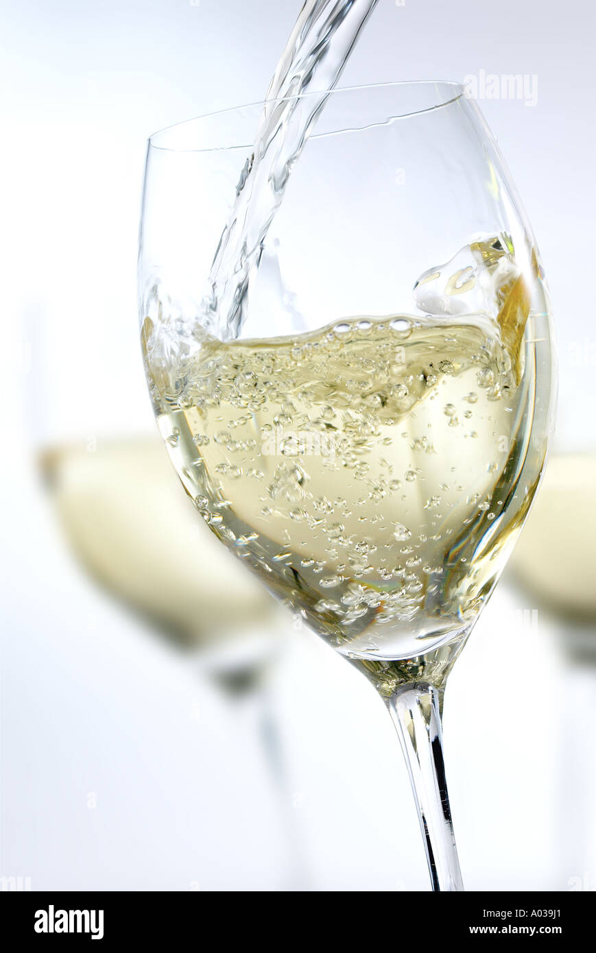 White Wine Pouring From The Bottle Intro The Glass Stock