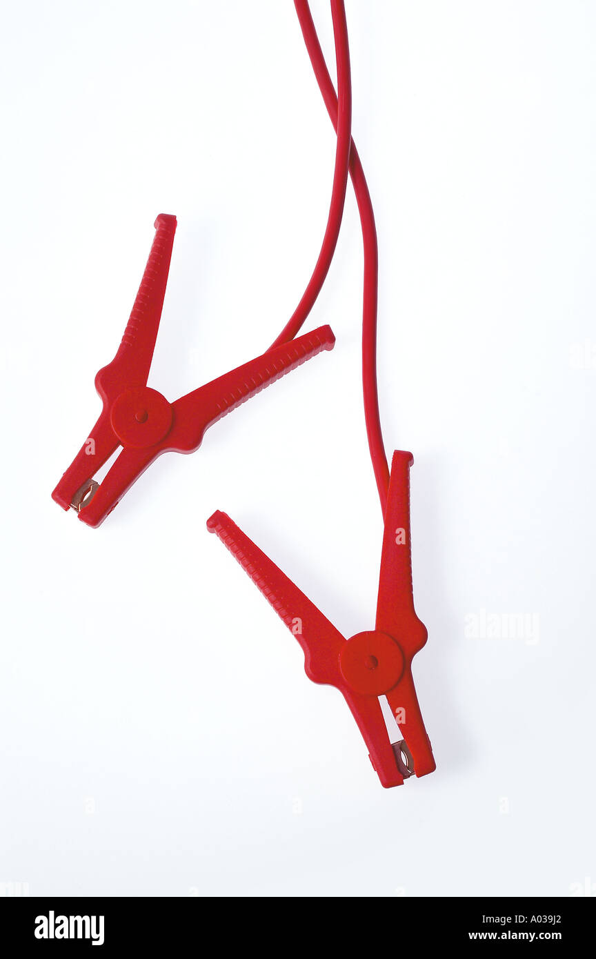 RED JUMP LEADS HANGING ON A WHITE WALL Stock Photo - Alamy