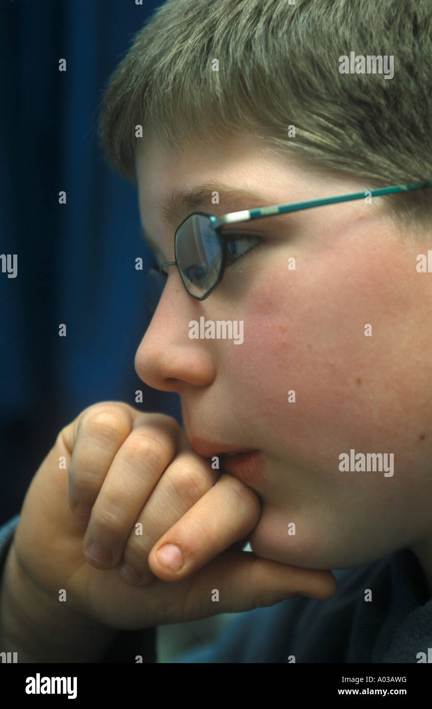 portrait of a young boy reflecting on something Stock Photo - Alamy