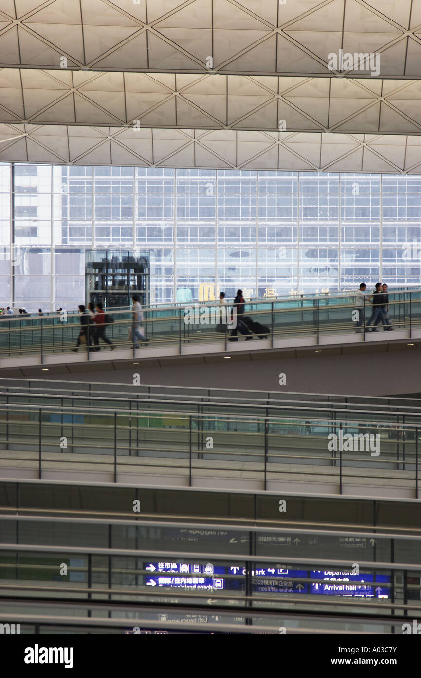 Passengers Walking Along Ramps At Hong Kong International Airport Stock ...