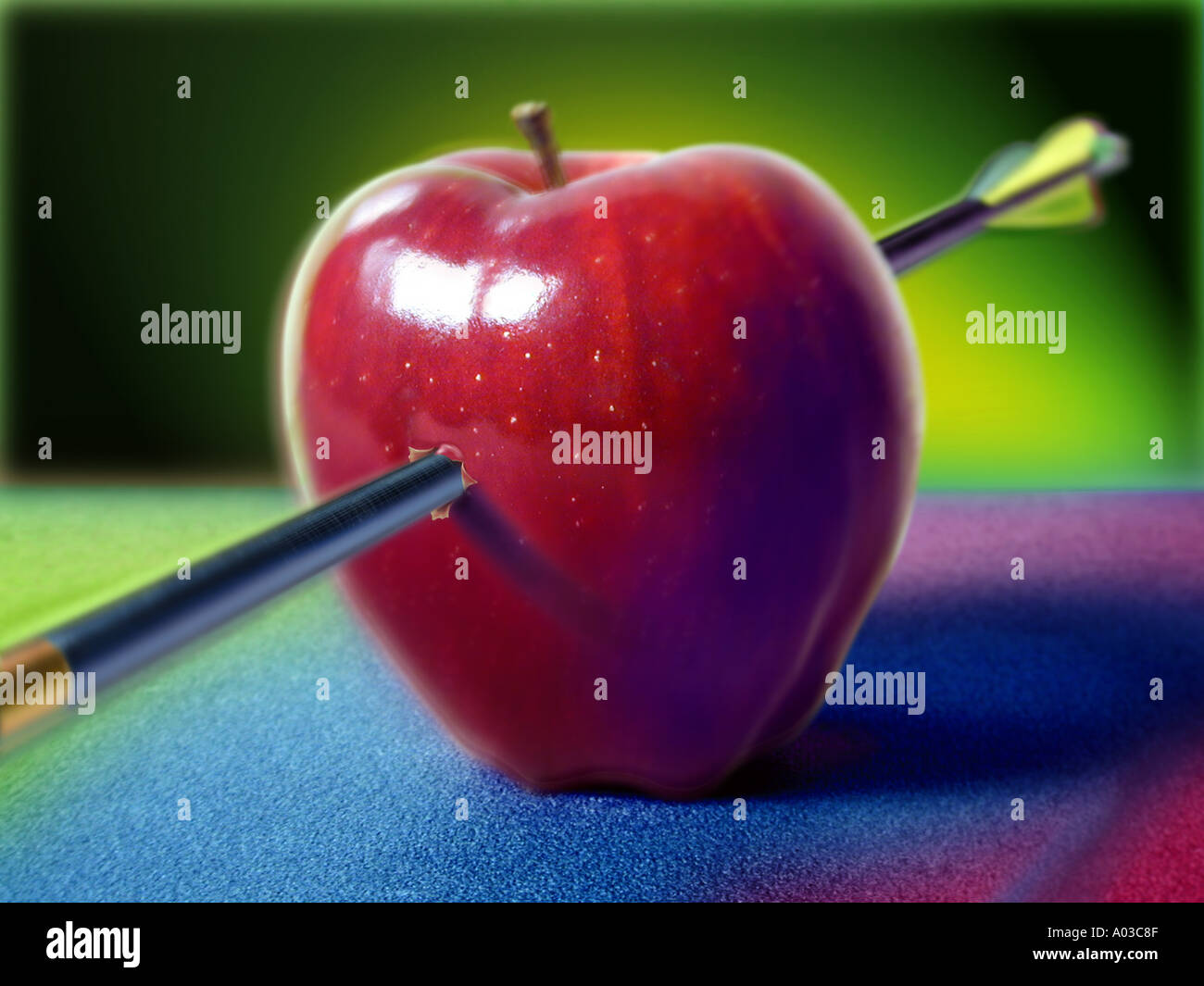 red apple hit by an arrow Stock Photo - Alamy