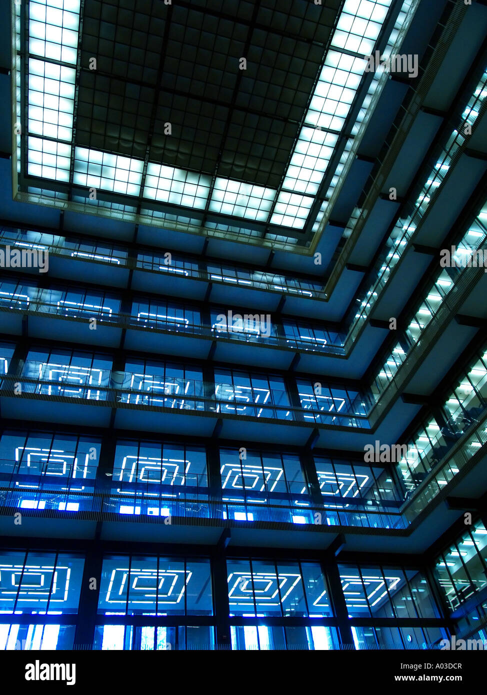 Terraced floors, glass walls, and interior lighting inside the foyer of ...